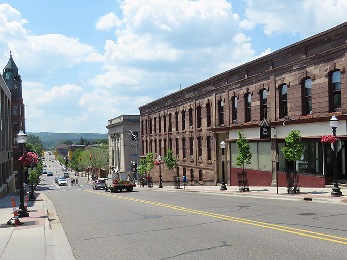 Historic brick buildings line this charming street like old friends sharing stories across the decades.