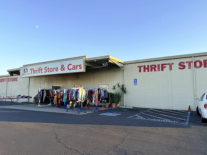 Mission Thrift's exterior welcomes bargain hunters with racks of colorful clothing spilling into the parking lot. Treasure hunting begins before you even step inside!