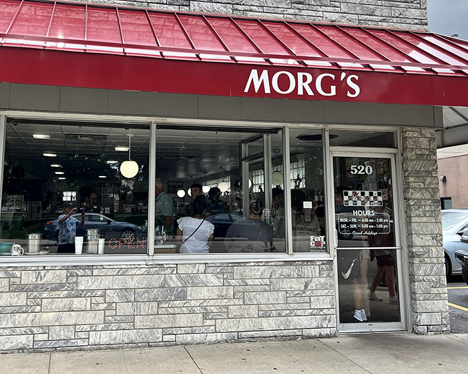 Morg's iconic red awning beckons hungry travelers like a lighthouse for comfort food enthusiasts.