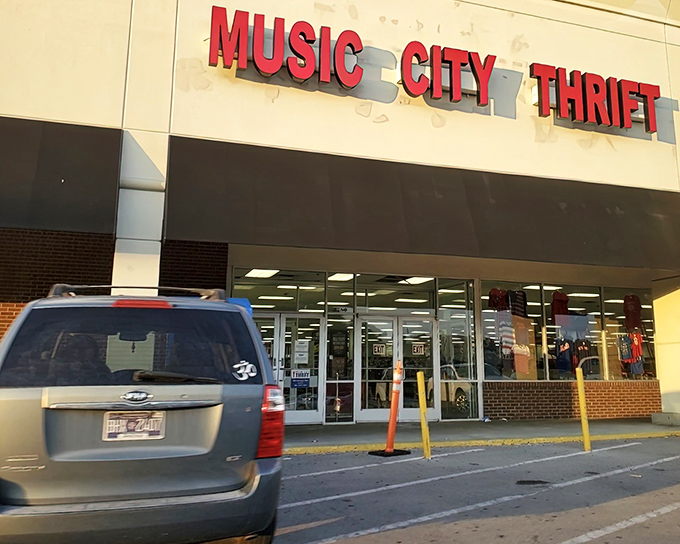 The bright red sign of Music City Thrift beckons like a siren song to bargain hunters. Treasure awaits inside!