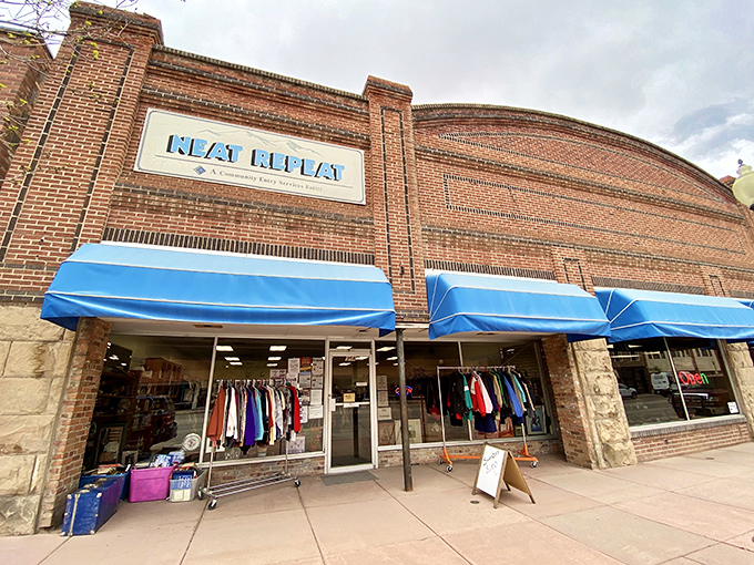 Neat Repeat's iconic brick facade and blue awnings - where bargain hunters find fashion gold without breaking the bank.