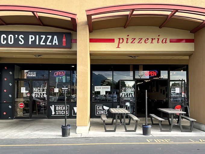 Nico's Pizza storefront beckons with its simple "pizzeria" sign. Sometimes the most unassuming doors hide the most extraordinary slices!