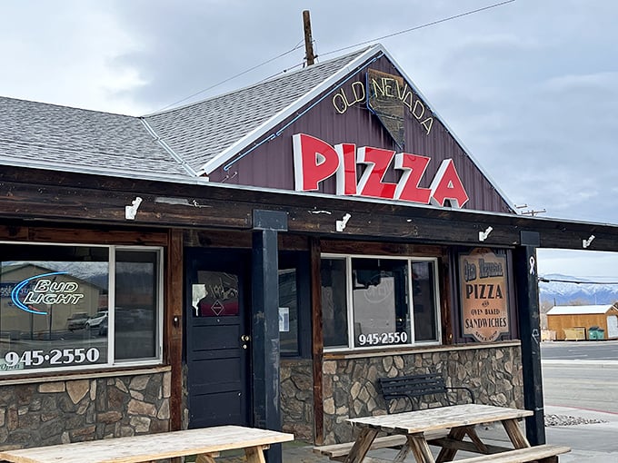 The rustic charm of Old Nevada Pizza beckons like a desert mirage for hungry travelers on Highway 95.
