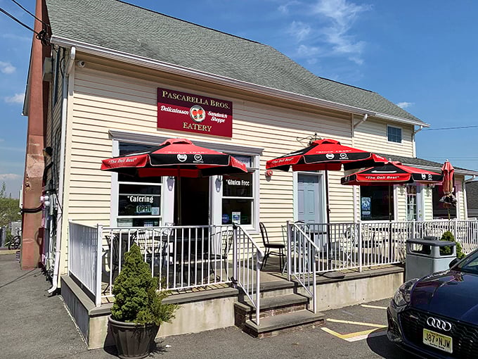 The humble yellow exterior of Pascarella Brothers hides sandwich greatness within. Red umbrellas invite you to stay awhile.