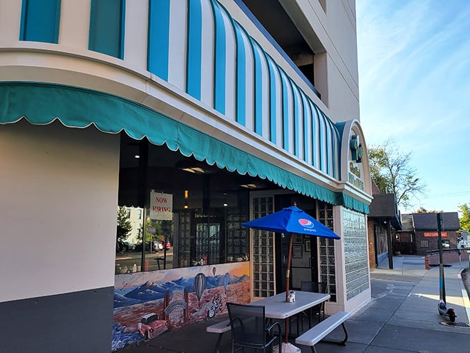 The iconic turquoise awning of Peg's Glorified Ham n Eggs beckons like a breakfast lighthouse on Sierra Street. A local institution where morning dreams come true!
