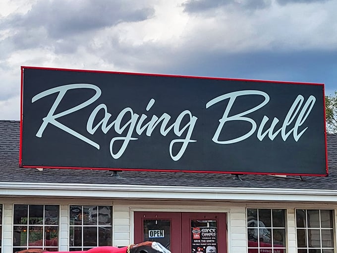 The bold "Raging Bull" sign promises a steak experience that lives up to its name. Like a matador's cape, it beckons hungry diners inside.