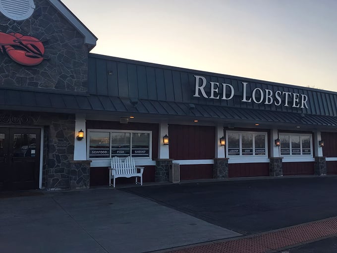 Red Lobster's iconic stone facade welcomes seafood lovers like a lighthouse beckoning ships to shore.