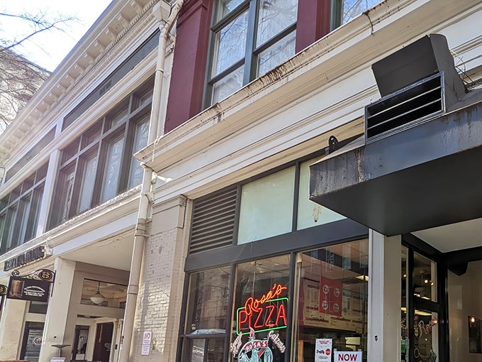 Rosa's Pizza glowing neon sign beckons like an old friend, promising New York-style slices that transport you straight to Manhattan.