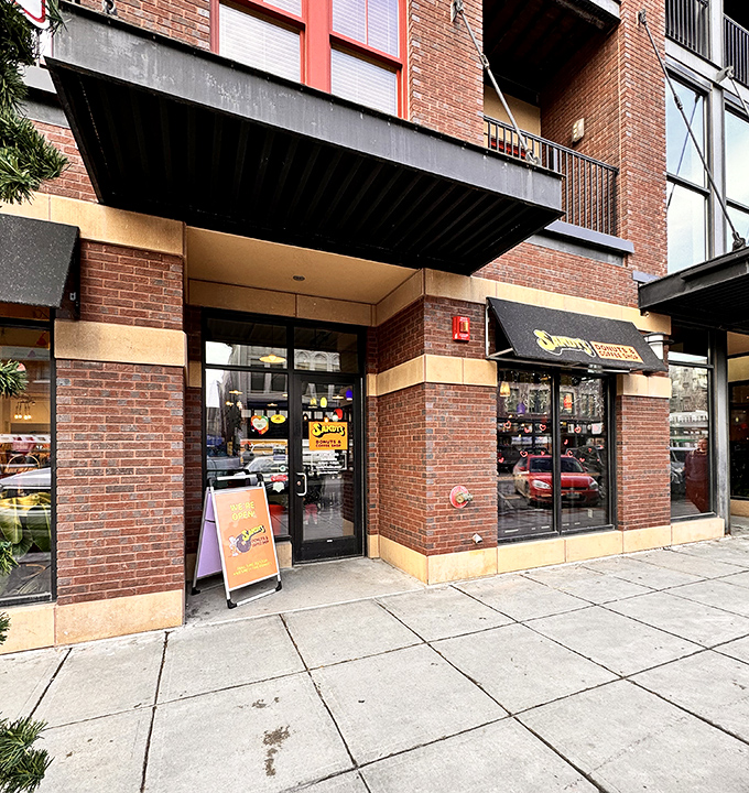 The unassuming brick storefront of Sandy's Donuts hides a world of sweet treasures waiting to be discovered.