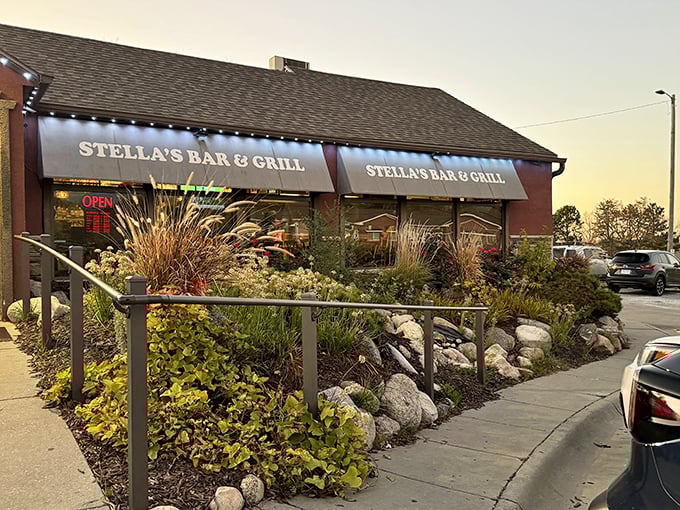 Stella's Bar & Grill welcomes you with lush landscaping that says "come for the greenery, stay for the legendary burgers."