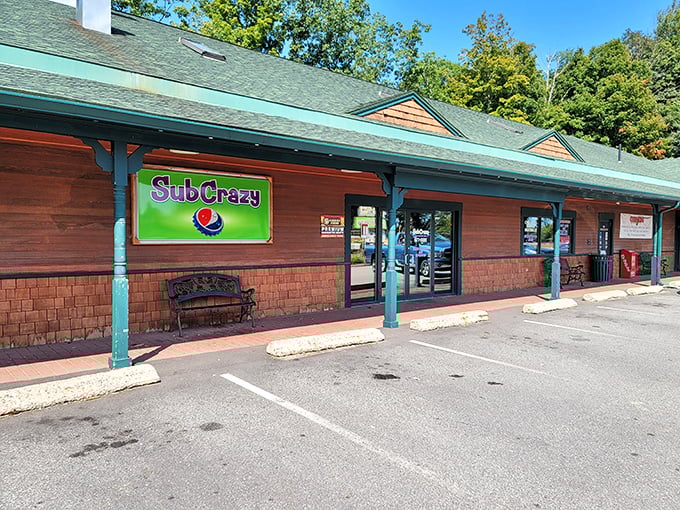 Sub Crazy's wooden storefront promises sandwich magic behind that bright green sign. Small-town charm, big-time flavor!
