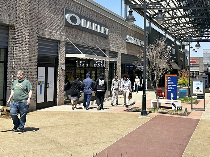 The welcoming entrance to Tanger Outlets beckons like a friendly neighborhood where bargains live happily.