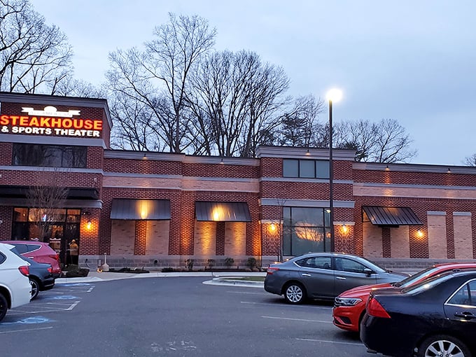 The All American Steakhouse glows like a beacon for hungry travelers. This brick-faced sports haven promises a perfect marriage of game day and gourmet cuts.