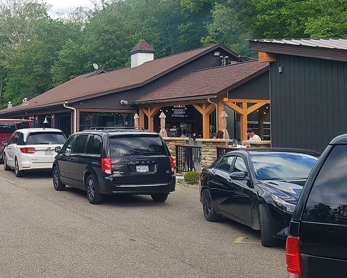 The Bear's Den exterior beckons with rustic charm. This woodland hideaway promises steaks worth the drive through Ohio's countryside.