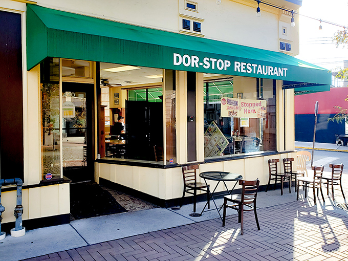 The iconic green awning of Dor-Stop Restaurant beckons hungry Pittsburghers like a breakfast lighthouse on a foggy morning.