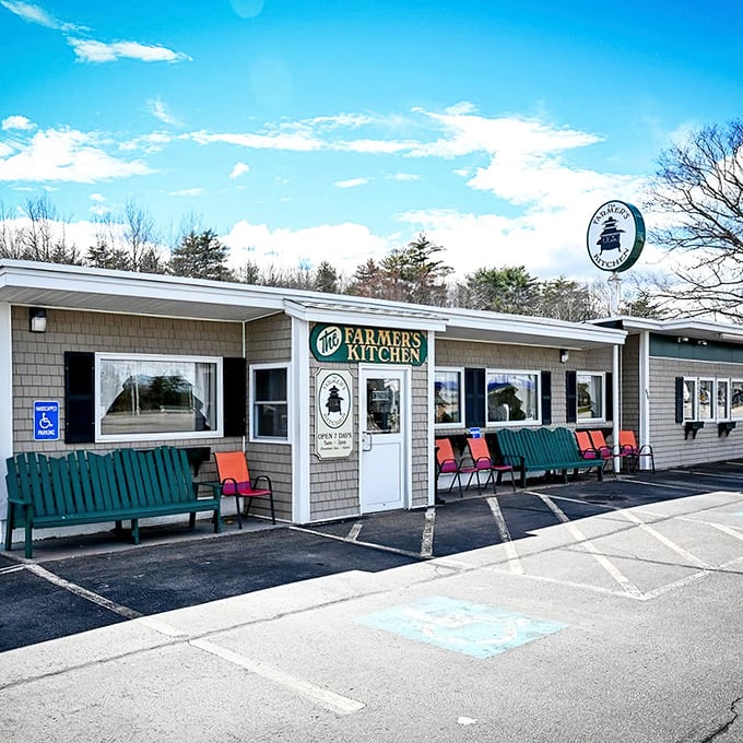 The Farmer's Kitchen exterior welcomes hungry travelers with its humble charm and green benches &ndash; burger paradise hiding in plain sight!