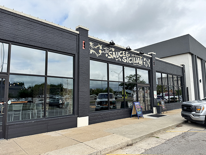 The Saucee Sicilian's sleek black exterior isn't just a pretty face—it's a beacon calling pizza lovers home to flavor paradise.