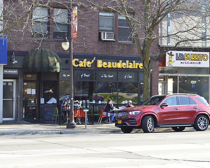 The bright yellow "Cafe Beaudelaire" sign beckons like a tropical sun in the heart of Ames, promising Brazilian flavors that'll make you forget you're in Iowa.
