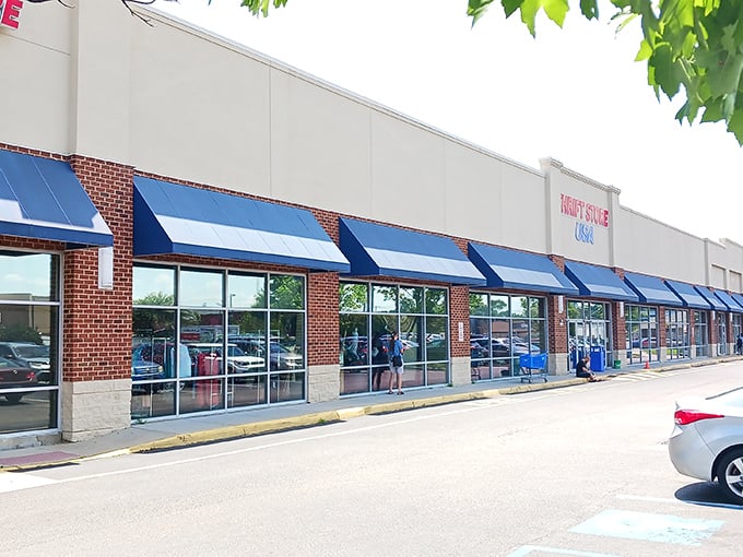 The beige facade of Thrift Store USA beckons like a siren call to bargain hunters. Inside those doors, treasures await discovery!