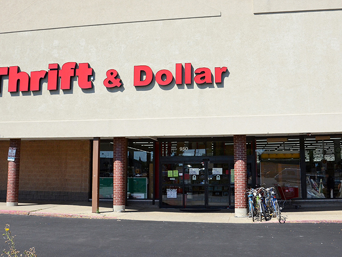 The bright red "Thrift & Dollar" sign beckons like a lighthouse for bargain hunters. Treasure awaits inside!