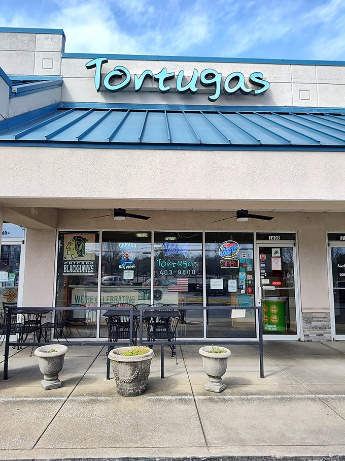 Tortugas' bright blue sign promises Chicago-style deep dish that'll make you forget you're in Alabama.