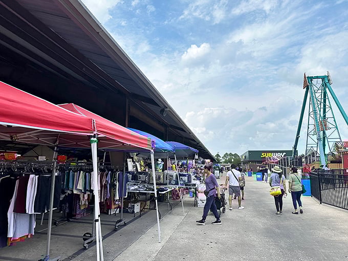 Shoppers paradise! Colorful tents line the walkway at Traders Village Houston, where treasure hunting meets amusement park thrills.