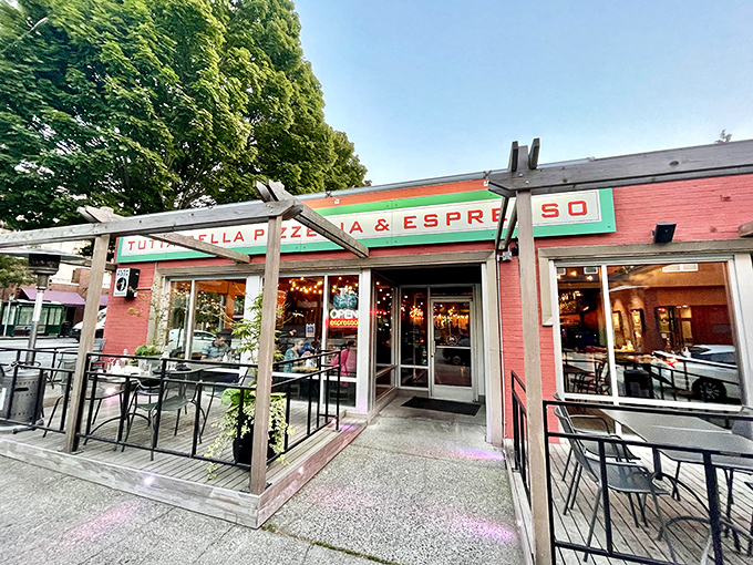 Tutta Bella's vibrant red exterior welcomes pizza lovers like a warm Italian hug in Seattle's Wallingford neighborhood.