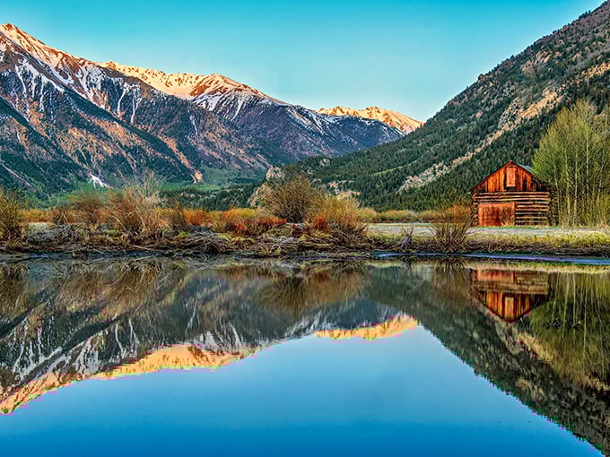 A rustic cabin perfectly mirrored in still waters with mountains that seem to touch the sky. Colorado's version of paradise found!