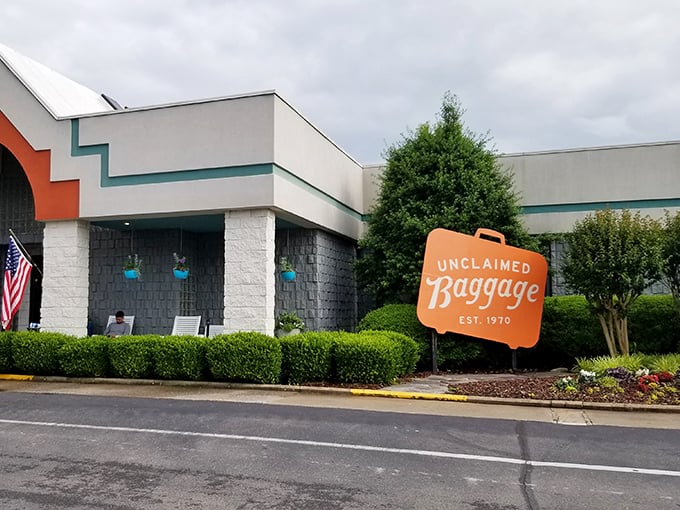 The ultimate lost luggage jackpot! Unclaimed Baggage's distinctive orange suitcase sign promises treasures that never made it home.