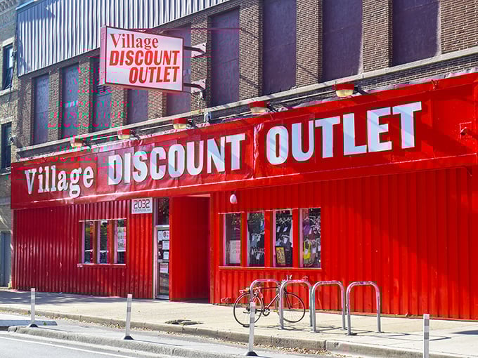 The bright red facade of Village Discount Outlet stands out like a bargain hunter's North Star on Milwaukee Avenue.