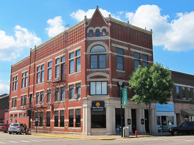 This magnificent brick cornerstone in Waupaca looks like it's been hosting town gossip and first dates since Herbert Hoover was in knickers.