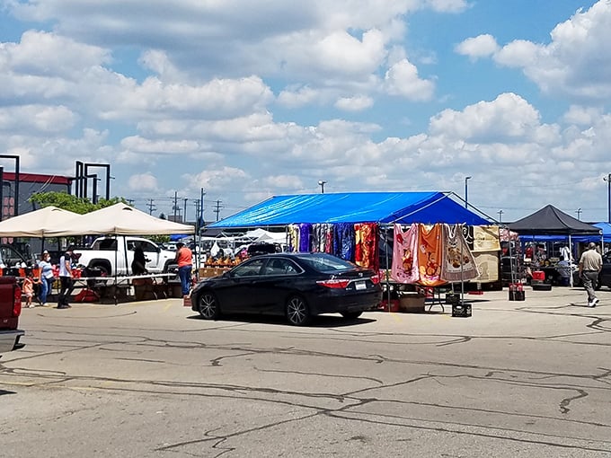 Bargain hunters' paradise! Colorful tents dot the Westland Flea Market parking lot, where treasures await under the bright Ohio sky.