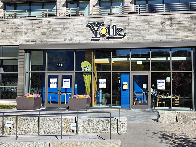 Yolk's modern storefront promises breakfast nirvana behind those striking blue doors. The name says it all – egg perfection awaits inside!
