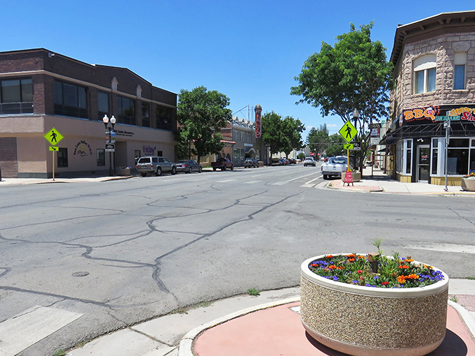 Downtown Alamosa's charming main street. Those flower planters aren't just pretty&mdash;they're saying "slow down and stay awhile."