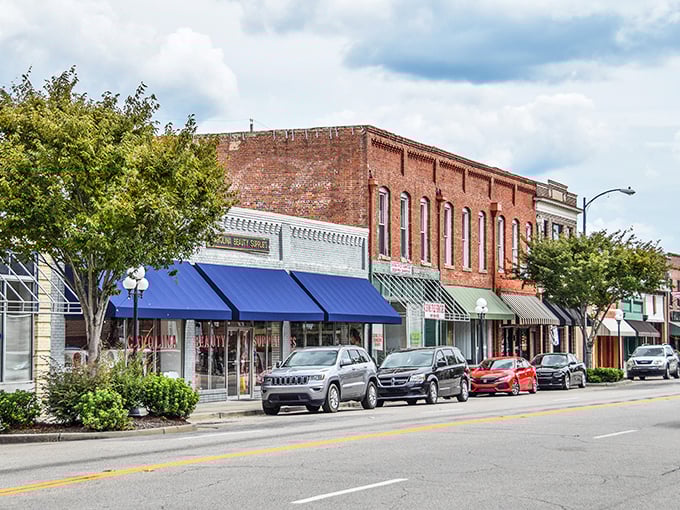 Classic storefronts line up like old friends, waiting to welcome you to downtown's timeless Southern charm.