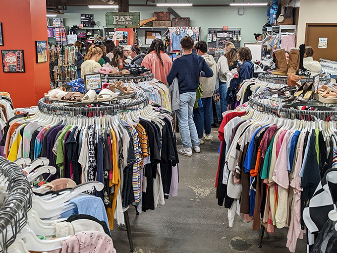 Treasure hunters navigate colorful racks at Buffalo Exchange, where yesterday's fashion finds new life today.