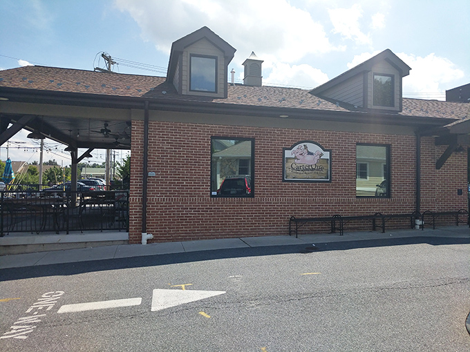 CarterQue's brick exterior feels like coming home, even if it's your first visit. That covered patio is calling your name on a sunny Maryland afternoon.