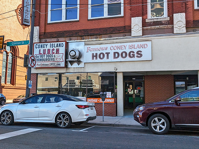 Coney Island Lunch's classic storefront beckons hot dog lovers with its vintage signs and promise of delicious Johnstown dogs.