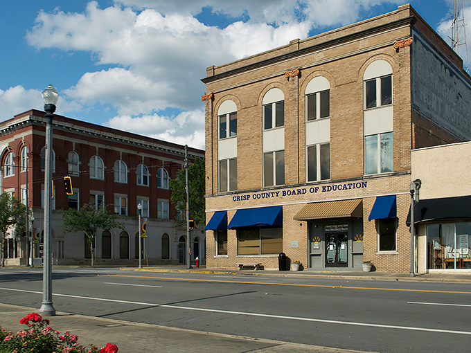 Crisp County's historic buildings stand tall against Georgia's blue sky. A postcard-perfect scene where your dollar stretches further.