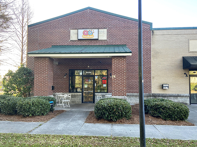 That little sidewalk table setup whispers "stay awhile" - because great donuts deserve proper appreciation time.