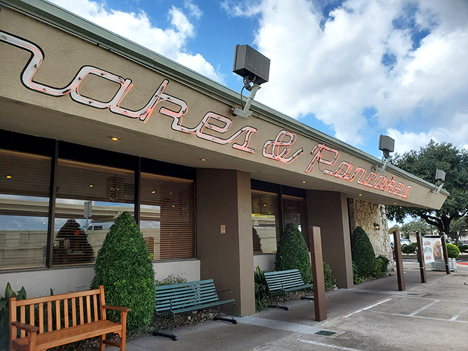 Steaks & Pancakes in glowing neon – Dot Coffee Shop's promise is simple and perfect. The kind of place where the waitress calls you "hon" and actually means it.