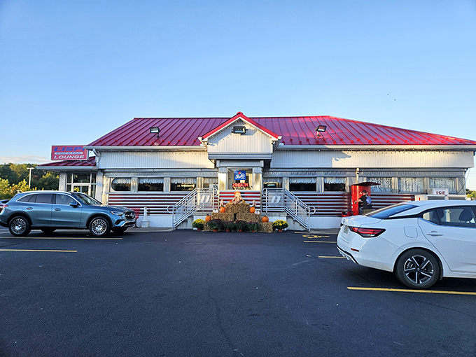 Evening glow transforms this roadside gem into a beacon for hungry travelers seeking authentic diner magic.