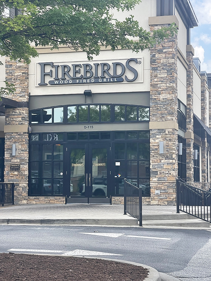 The elegant "Wood Fired Grill" sign hints at the smoky magic happening inside this Greenville gem.