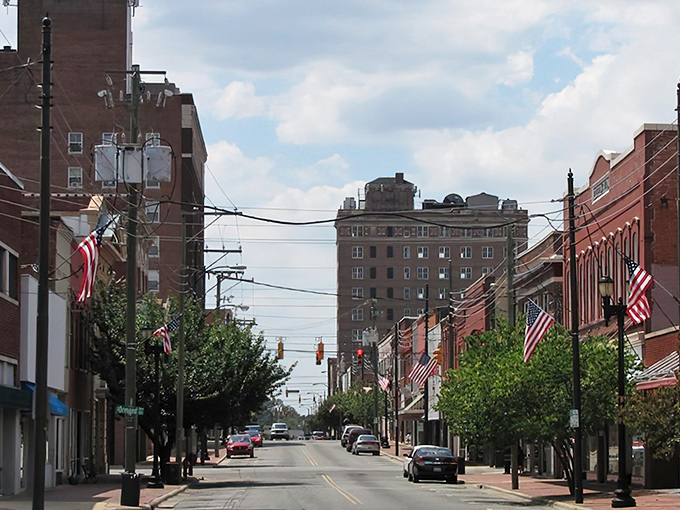 American flags line this charming Goldsboro street where historic architecture meets small-town hospitality.