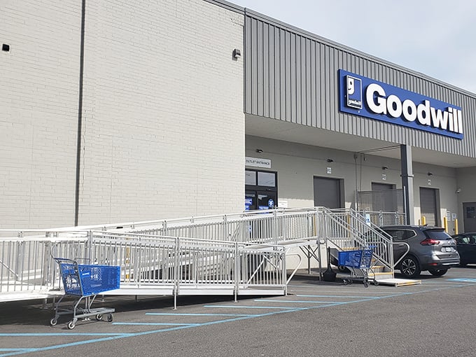 Blue carts stand at the ready like loyal sidekicks. At the Goodwill Outlet, every trip down that ramp feels like the start of a bold bargain-seeking expedition.