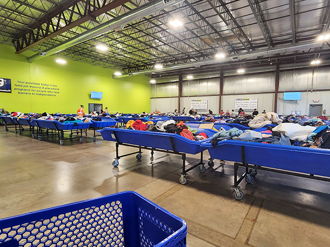 Blue bins as far as the eye can see! This sorting area at Goodwill is where yesterday's closet cleanouts become tomorrow's fashion finds.