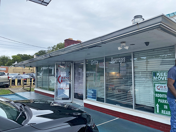 The classic diner windows at Greg's promise what's inside: honest cooking, hot coffee, and conversations that flow as smoothly as their gravy.