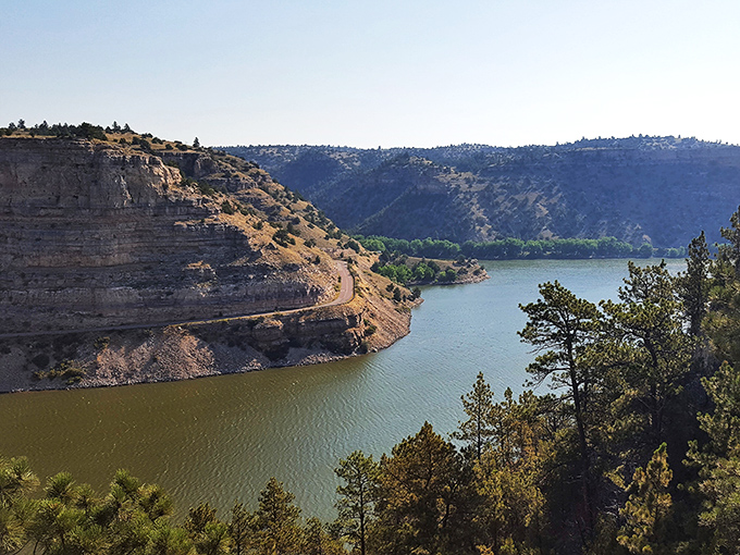 Dramatic canyon walls frame the lake like a postcard that forgot it wasn't supposed to be real.