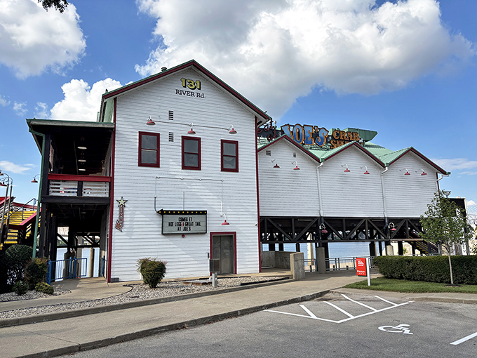 Joe's Crab Shack's impressive white building stands tall along the river, offering multiple levels for diners to enjoy seafood with spectacular water views.