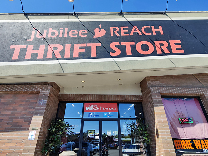 Bright signage welcomes shoppers to Jubilee REACH, where the "OPEN" sign might as well read "OPPORTUNITY." Every visit is like a treasure hunt with purpose.